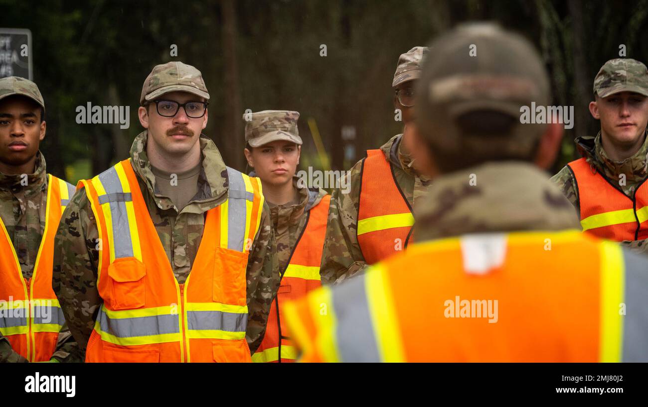 A line of 96th Force Support Squadron Airmen look for simulated debris ...