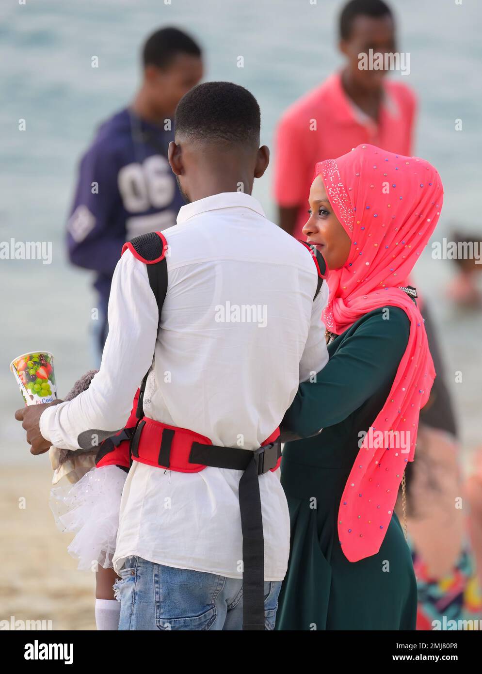 Contemporary communication of african locals on the beach, Stone Town ...