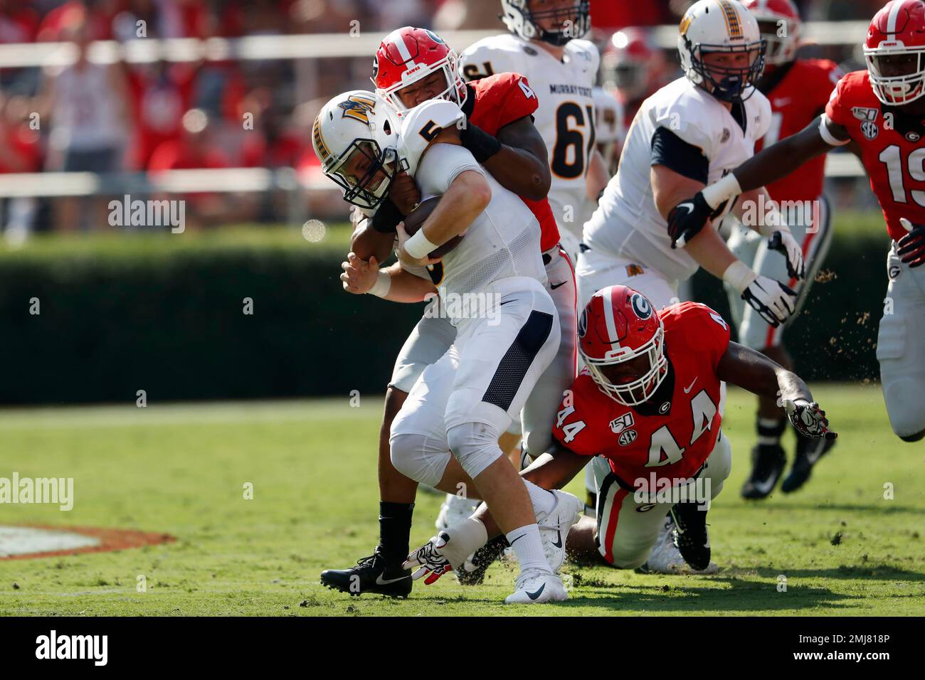 Murray State quarterback Preston Rice (5) is sacked by Georgia's Nolan ...