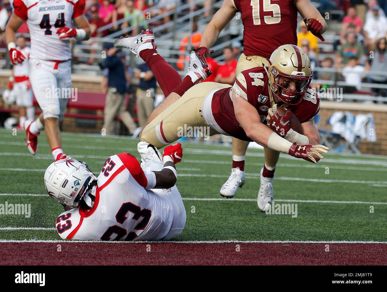 Boston College tight end Jake Burt (84) dives into the end zone for a ...