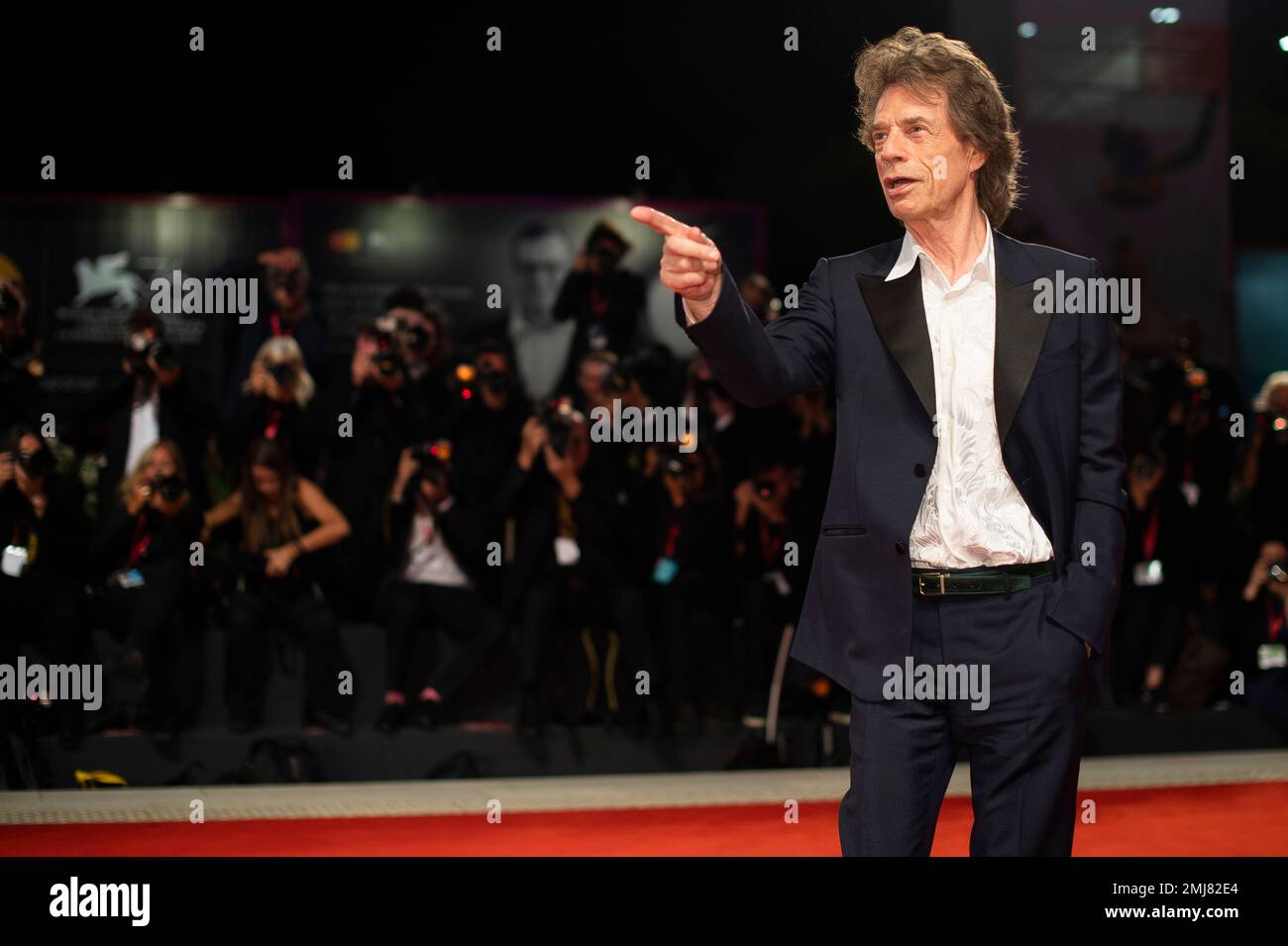 Actor Mick Jagger poses for photographers upon arrival at the premiere ...