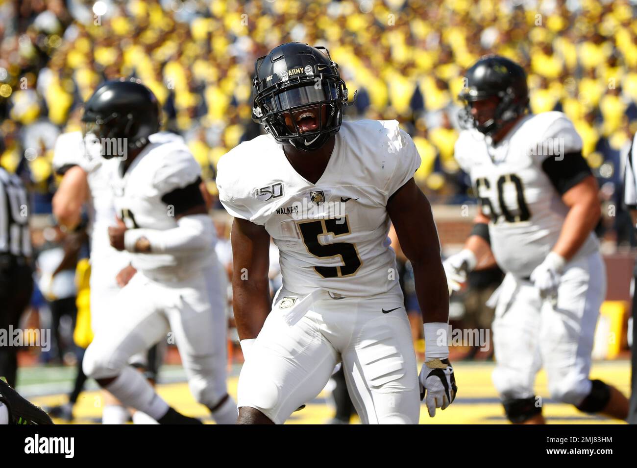 Army running back Kell Walker (5) celebrates a Sandon McCoy (3 ...