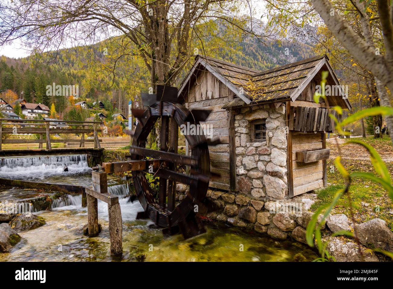 Water mill at the Jasna Lake, Kranjska Gora, Slovenia with running ...