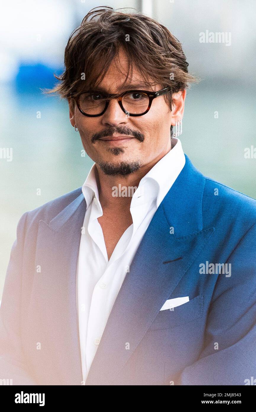 Actor Johnny Depp poses for photographers upon arrival for the photo ...