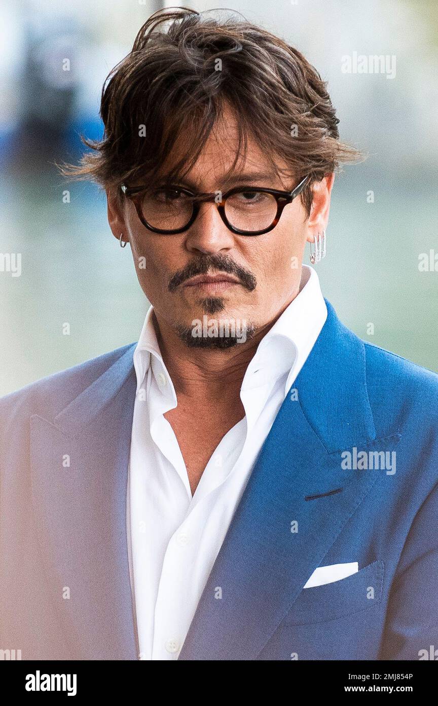 Actor Johnny Depp poses for photographers upon arrival for the photo ...