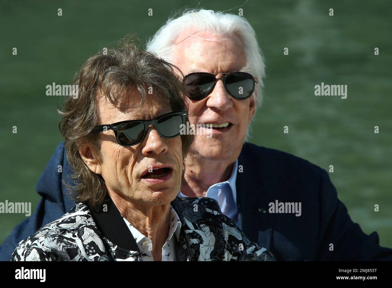 Actors Mick Jagger, left, and Donald Sutherland pose for photographers ...