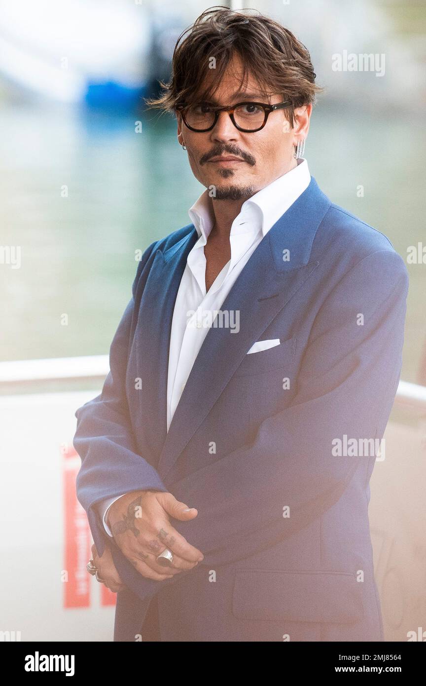 Actor Johnny Depp poses for photographers upon arrival for the photo ...