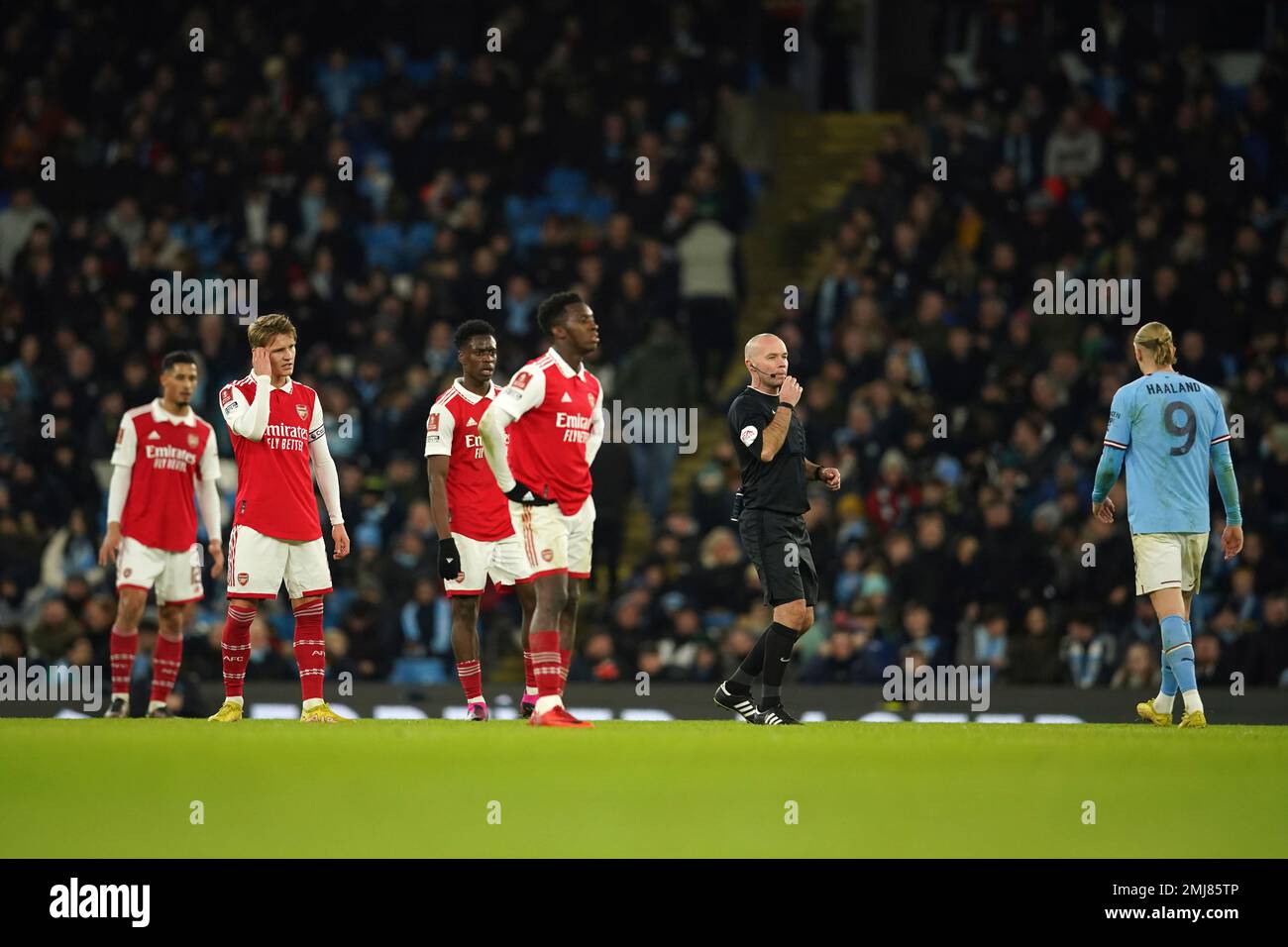 Arsenal's players react at the end of the English FA Cup 4th round ...