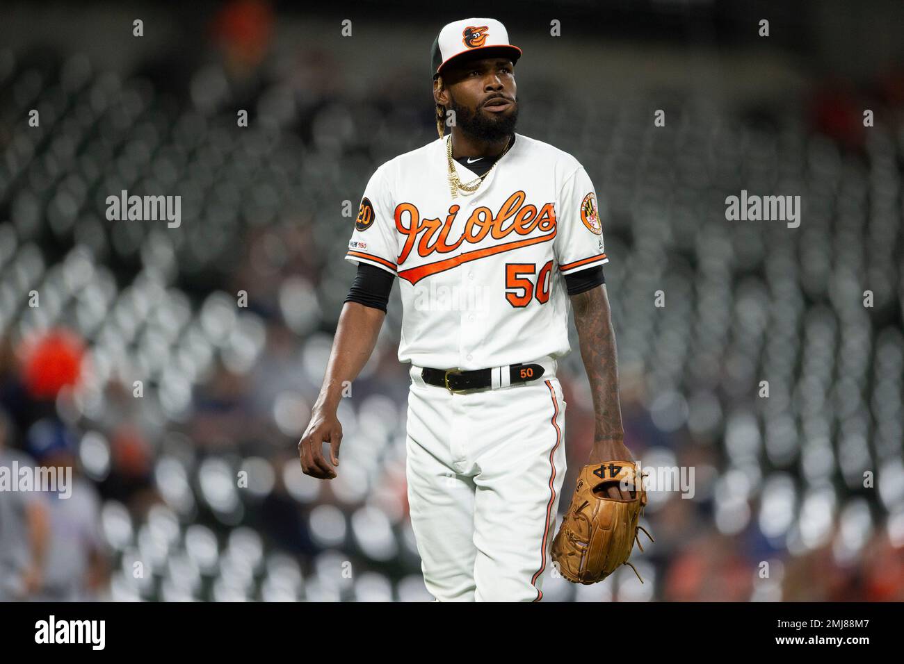 Baltimore Orioles relief pitcher Miguel Castro (50) walks off the field ...