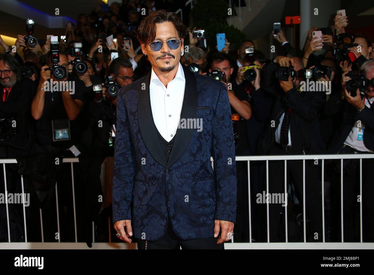 Actor Johnny Depp poses for photographers upon arrival at the premiere ...
