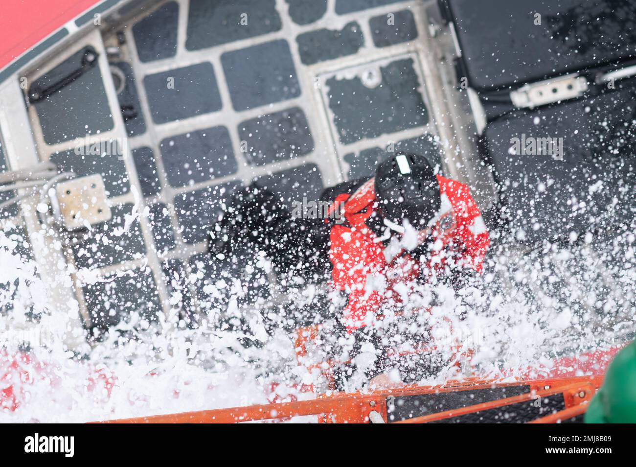 U.S. Coast Guard Petty Officer 3rd Class Logan Henderson, a machinery ...