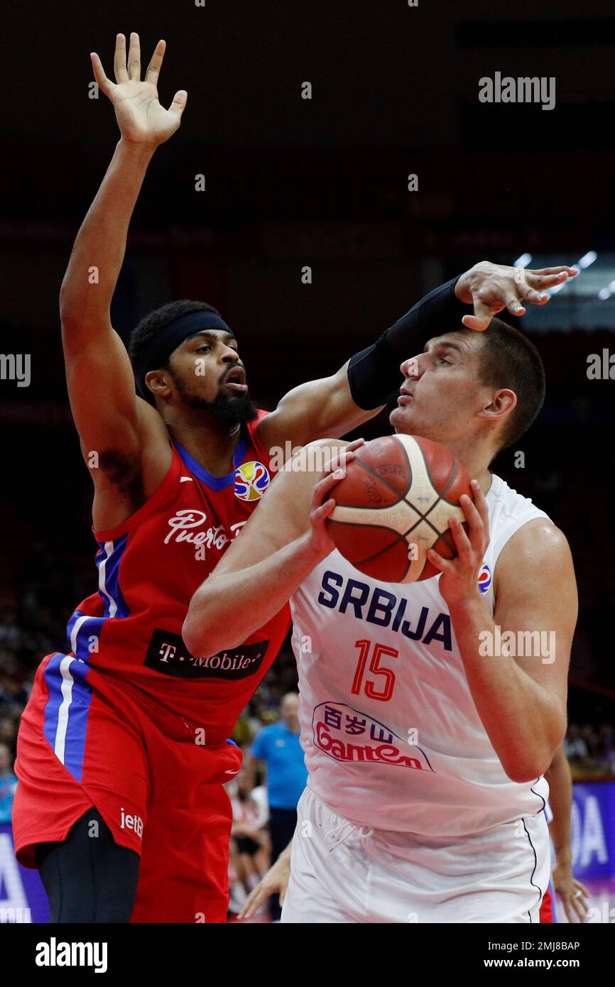 Devon Collier of Puerto Rico tries to block Nikola Jovicof Serbia to ...