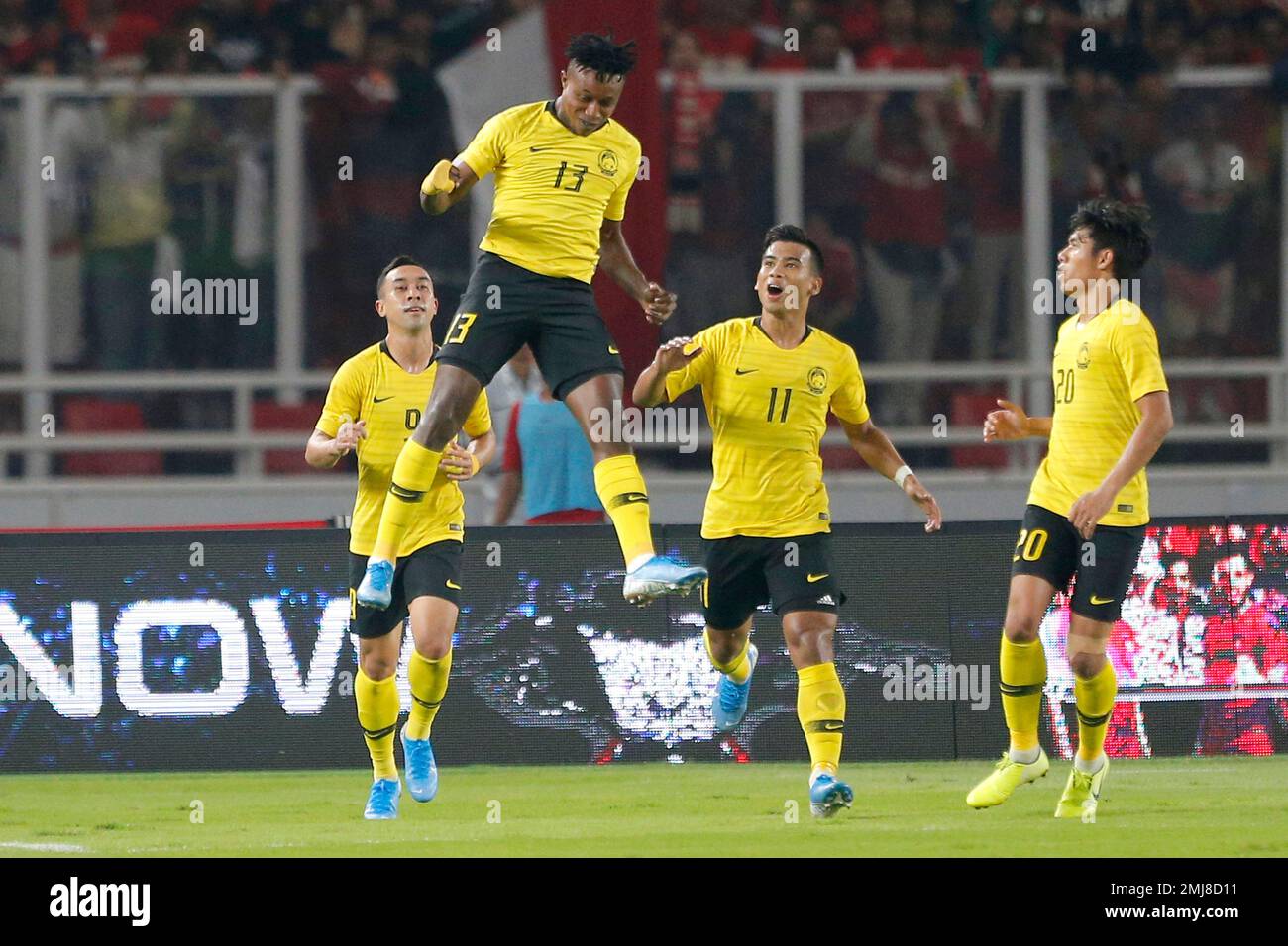 Malaysia's soccer team celebrate after scoring a goal during their ...