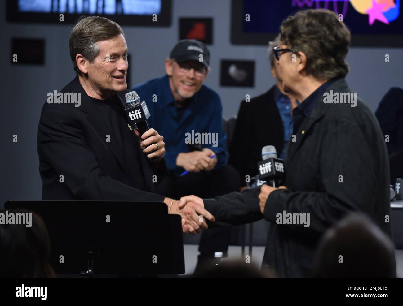 Toronto Mayor John Tory, left, presents Robbie Robertson with a key to ...