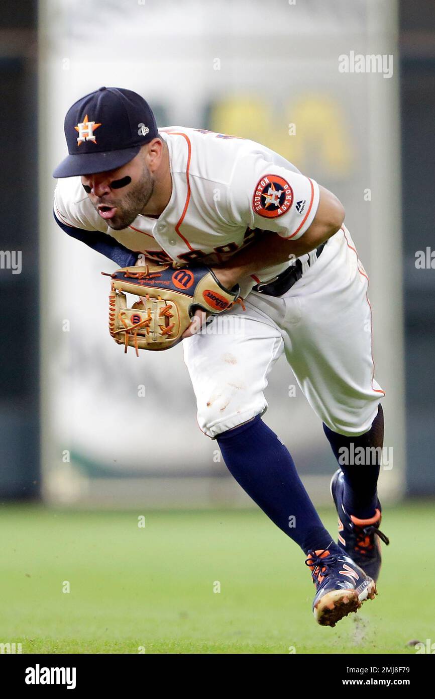Houston Astros second baseman Jose Altuve fields a hit during a ...