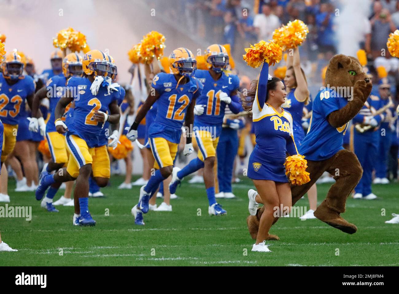 University of Pittsburgh cheerleaders, the Panther mascot and the ...