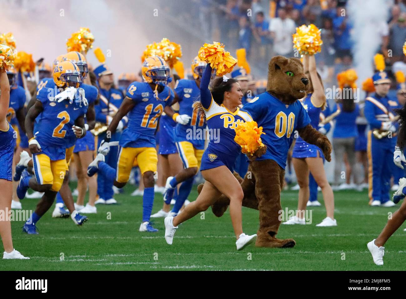 University of Pittsburgh cheerleaders, the Panther mascot and the ...