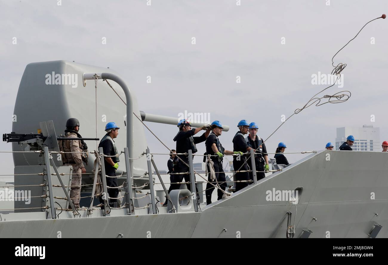Spanish sailors throw a line as the Spanish Navy frigate Mendez Nunez ...