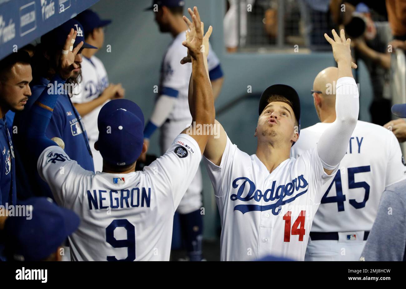 Los Angeles Dodgers' Enrique Hernandez, right, jokes with Kristopher ...