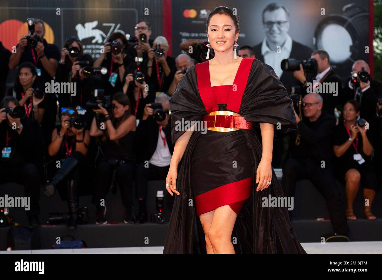 Gong Li poses for photographers upon arrival at the premiere of the ...