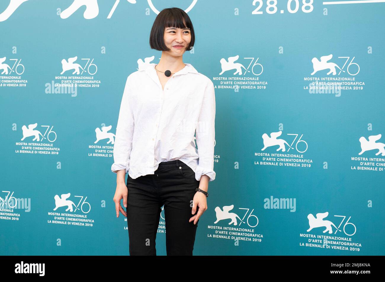 Actress Huang Xiangli poses for photographers at the photo call for the ...