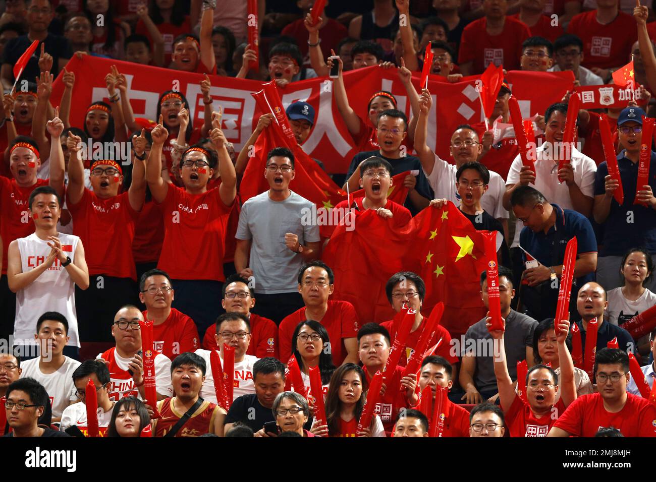 Fans of China's team cheer during their group phase game against ...