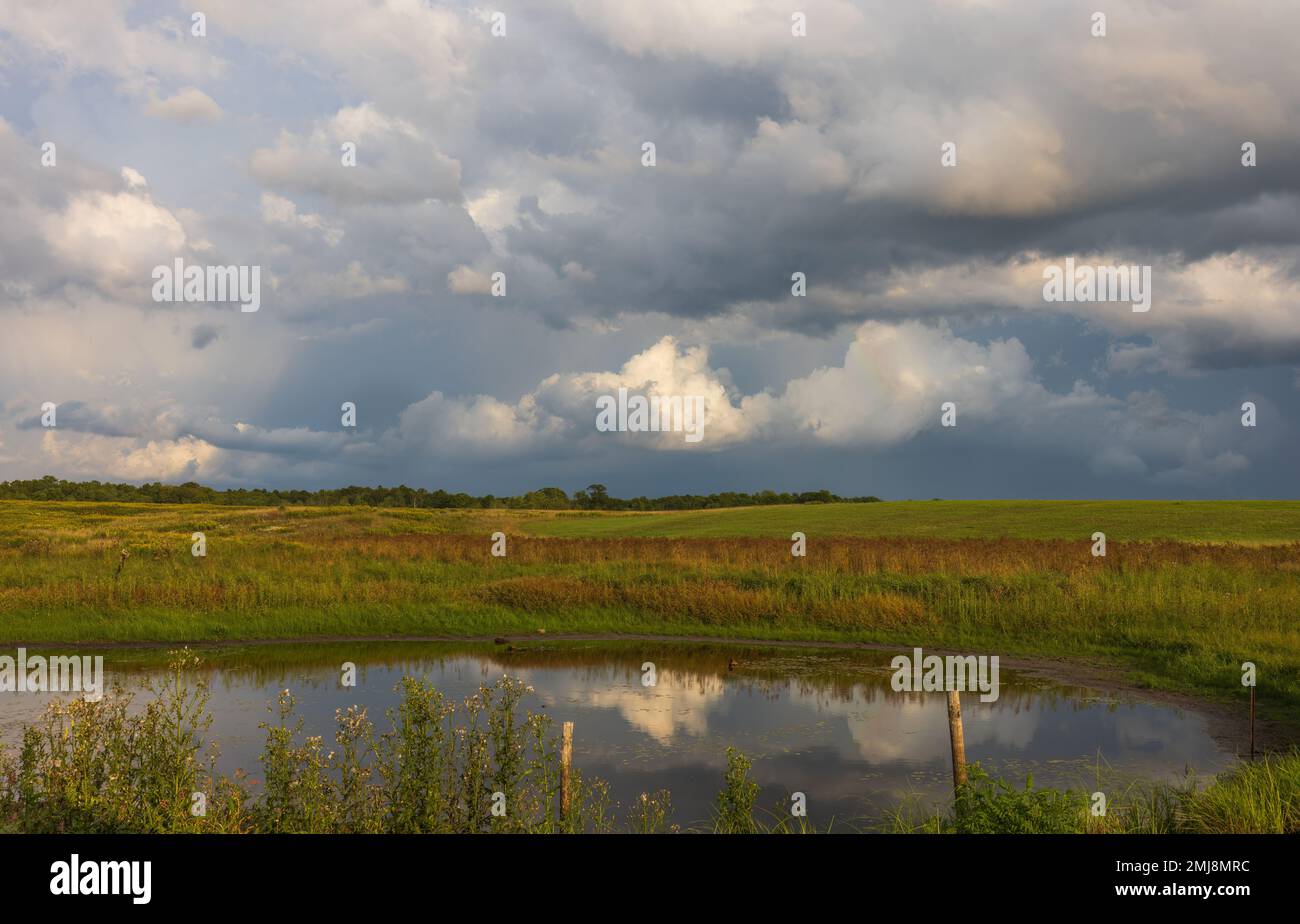 Storm clouds clearing over a farmer's field in northern Wisconsin Stock ...