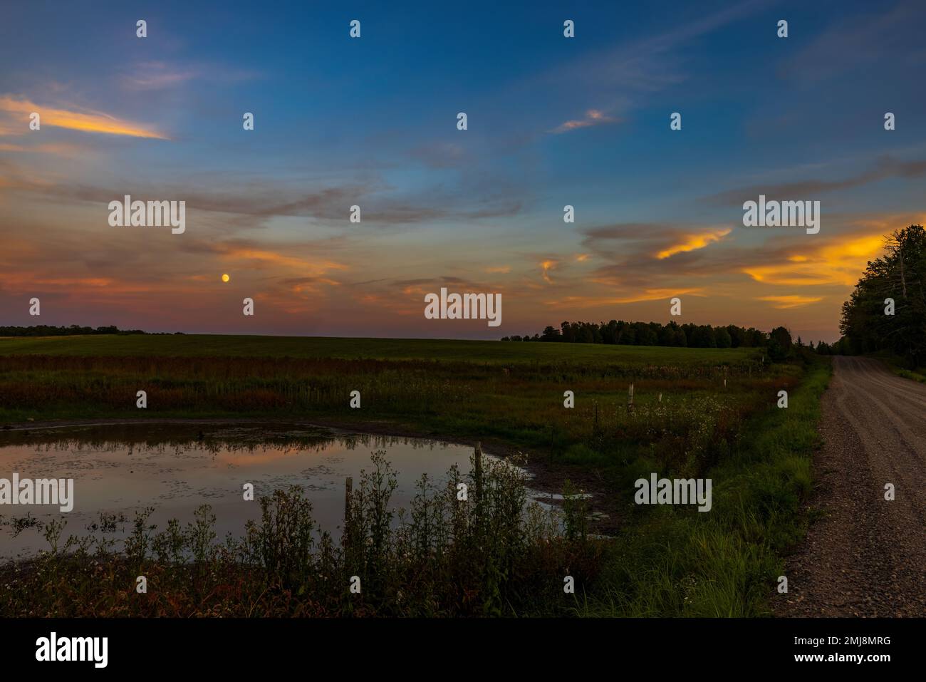 The moon rising over a farmer's field in northern Wisconsin Stock Photo ...