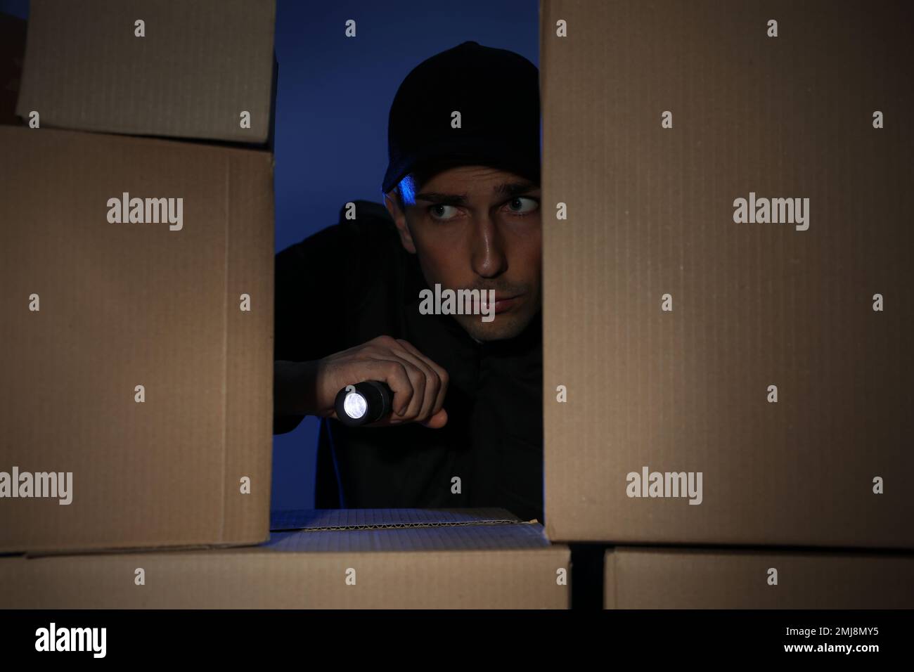 Dark warehouse boxes hi-res stock photography and images - Alamy