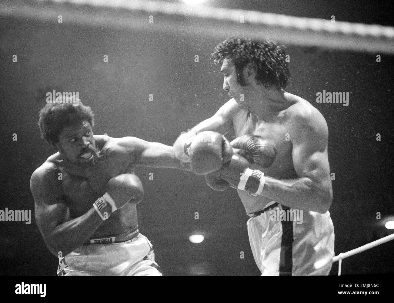 Ron Lyle of the U.S., left, makes a point with his left hand in his ...