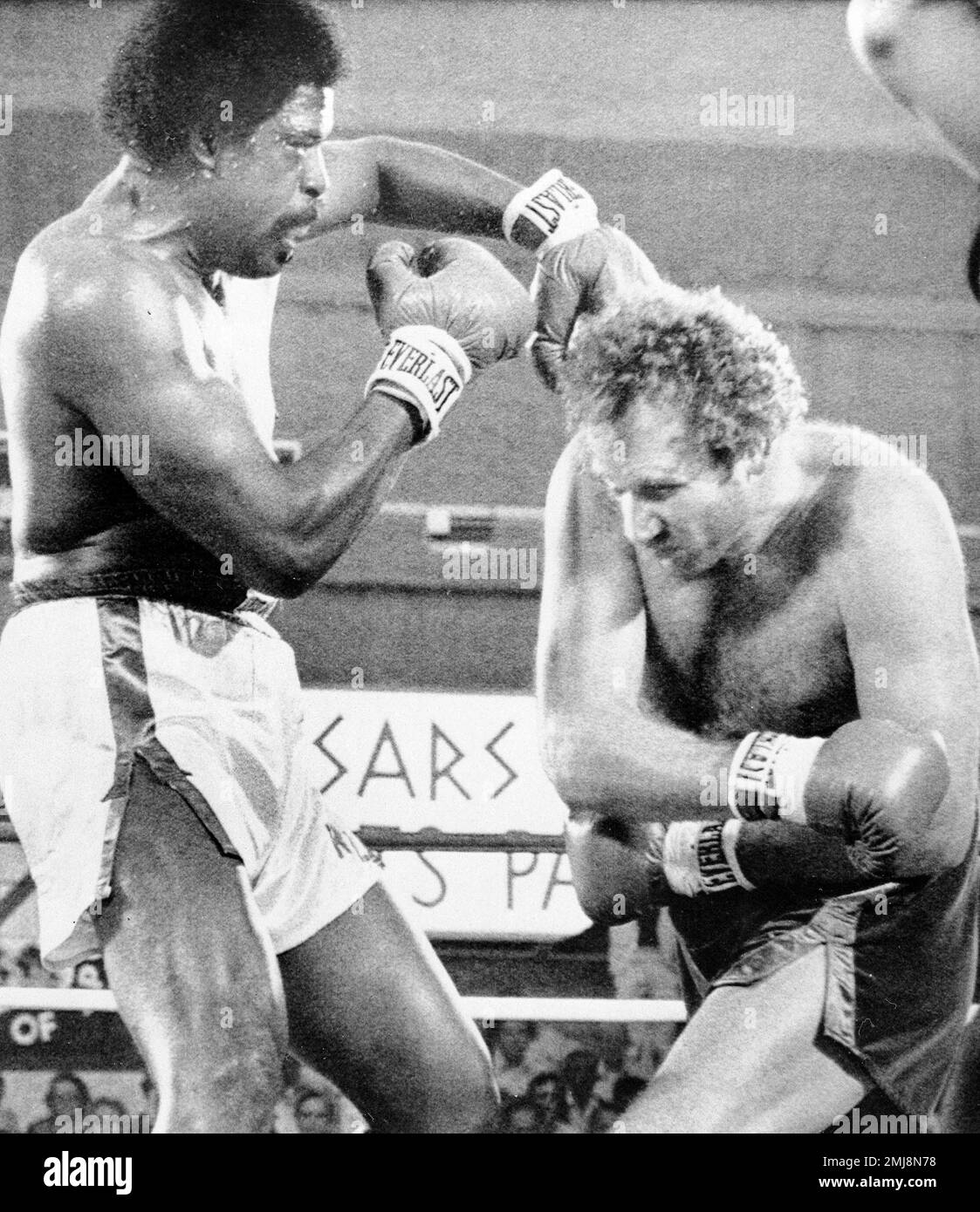 Ron Lyle blocks a swing from the "Fighting Frenchman," Scott LeDoux at ...