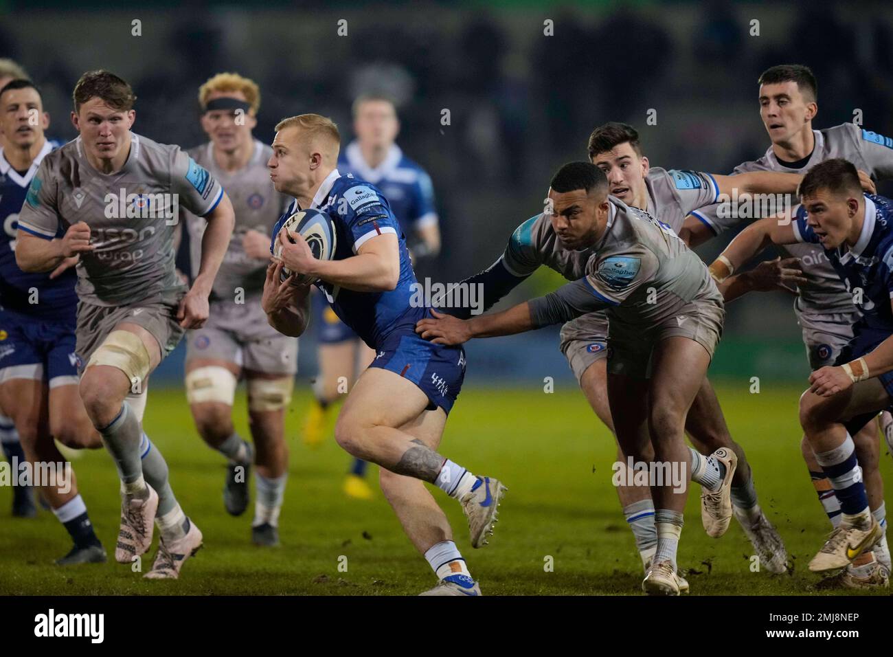 Aaron Reed #23 of Sale Sharks breaks past Max Ojomoh #12 of Bath Rugby ...