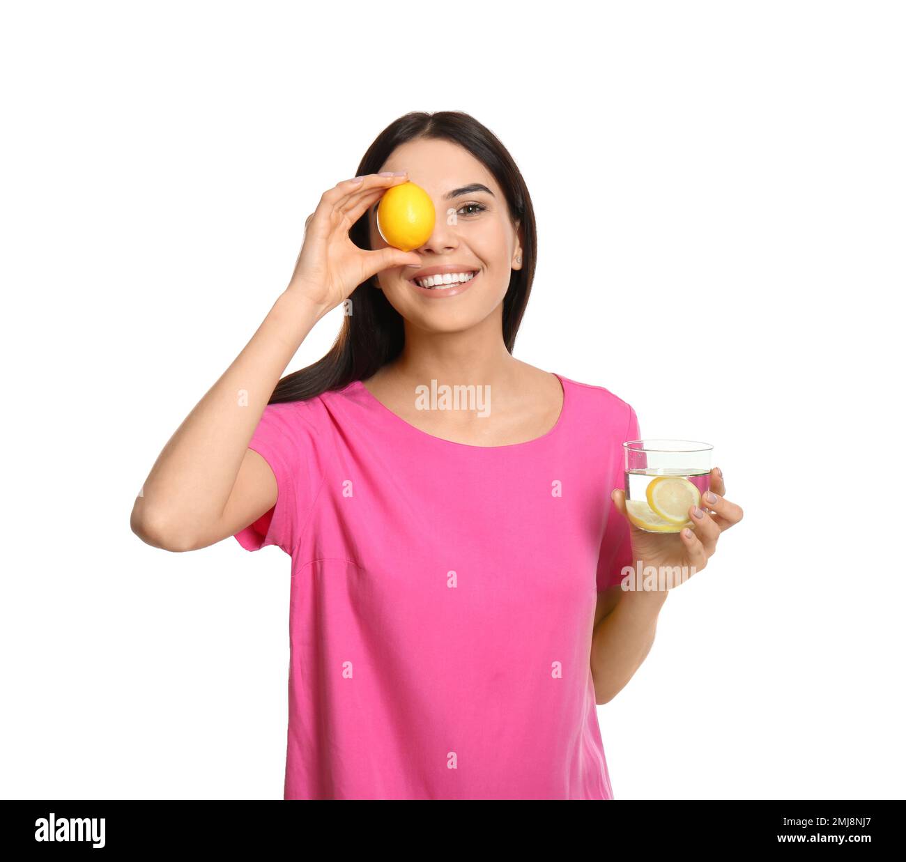 Beautiful young woman with tasty lemon water and fresh fruit on white ...