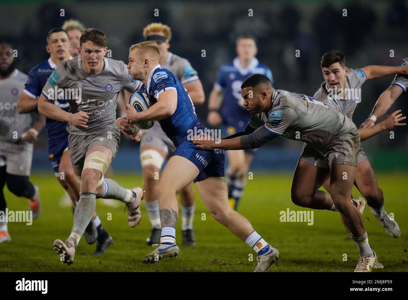 Aaron Reed #23 of Sale Sharks breaks past Max Ojomoh #12 of Bath Rugby ...