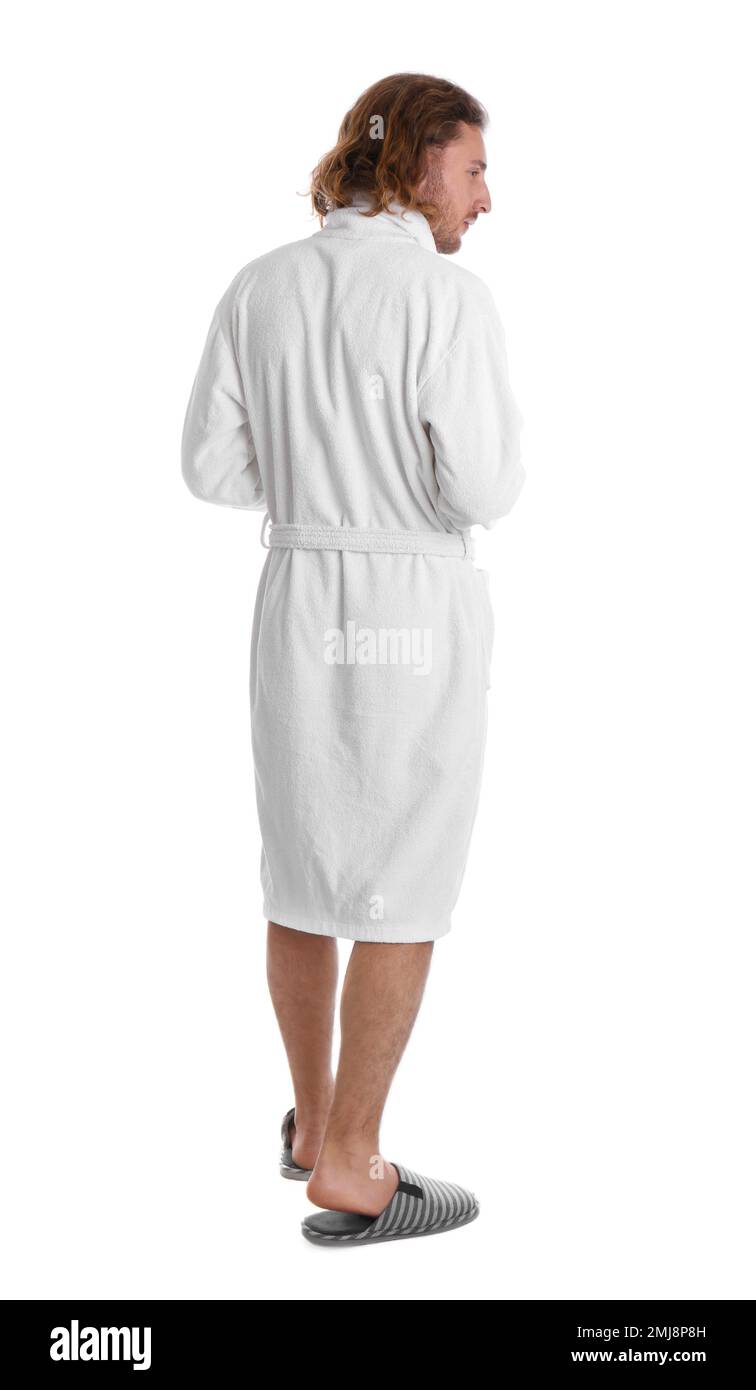 Young man in bathrobe on white background Stock Photo - Alamy