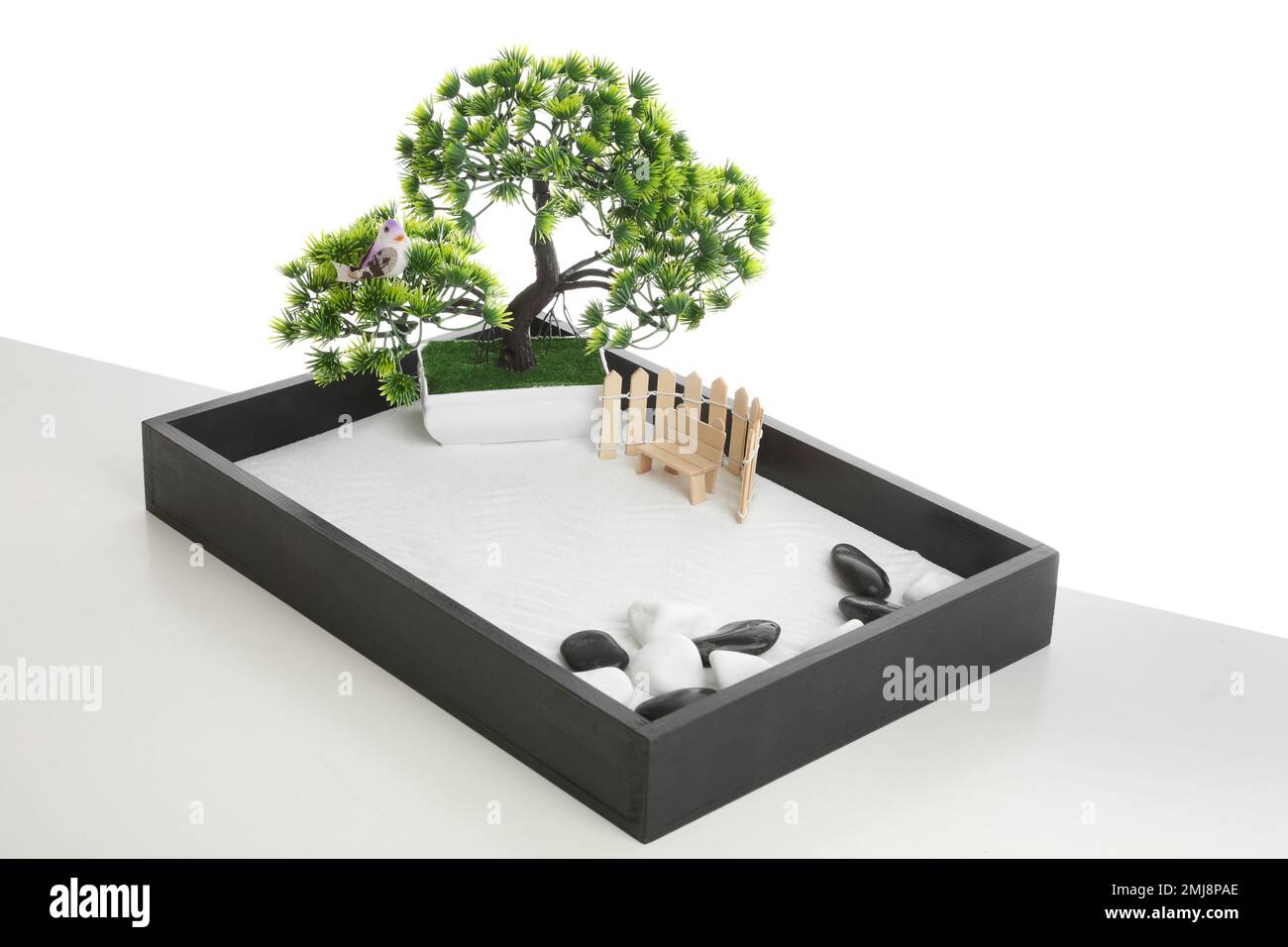 Beautiful miniature zen garden isolated on white Stock Photo - Alamy