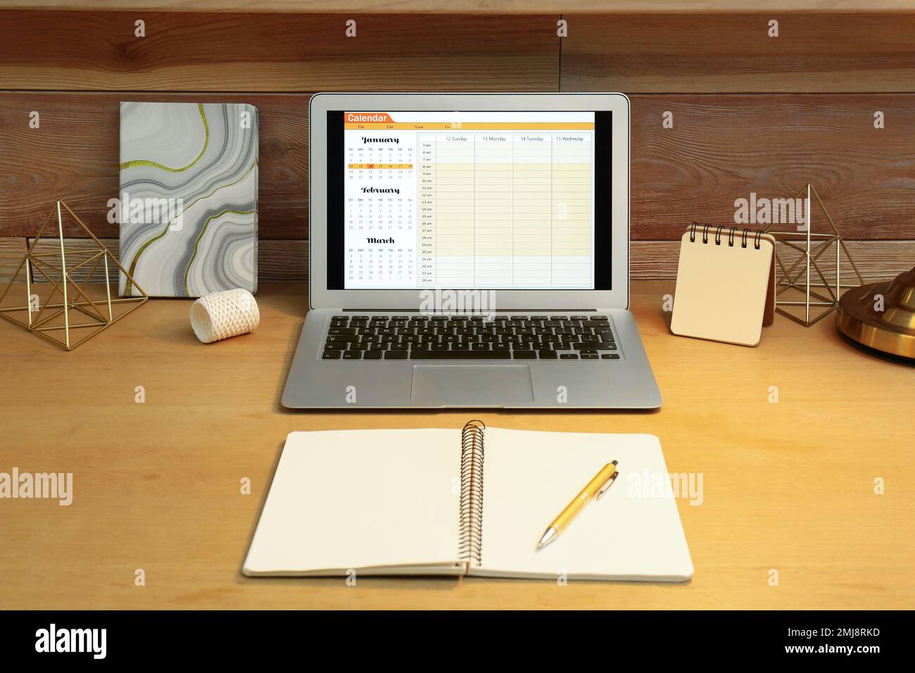 Modern laptop with calendar on screen in office Stock Photo - Alamy