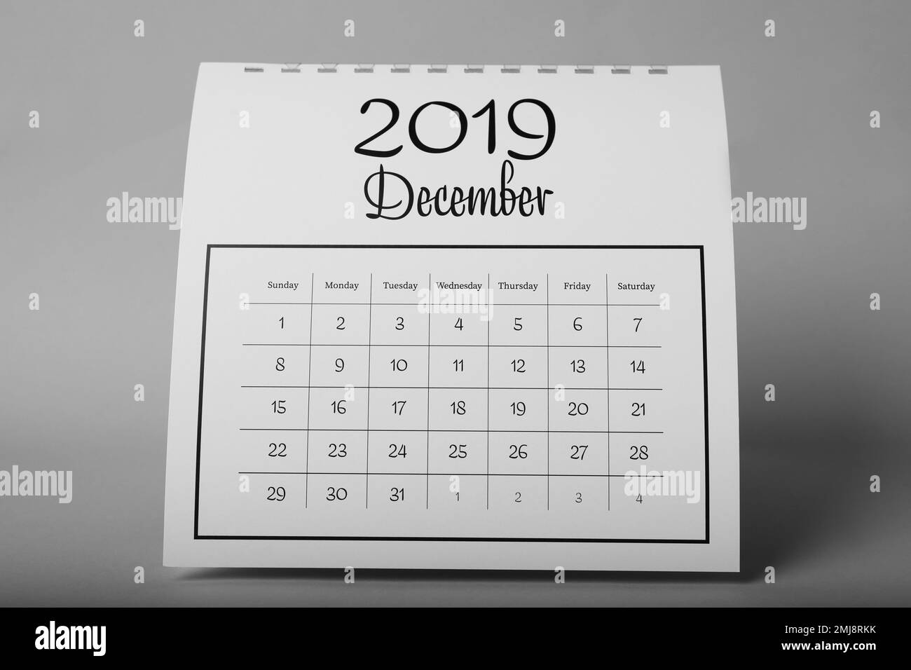 Paper calendar on grey background. Planning concept Stock Photo - Alamy
