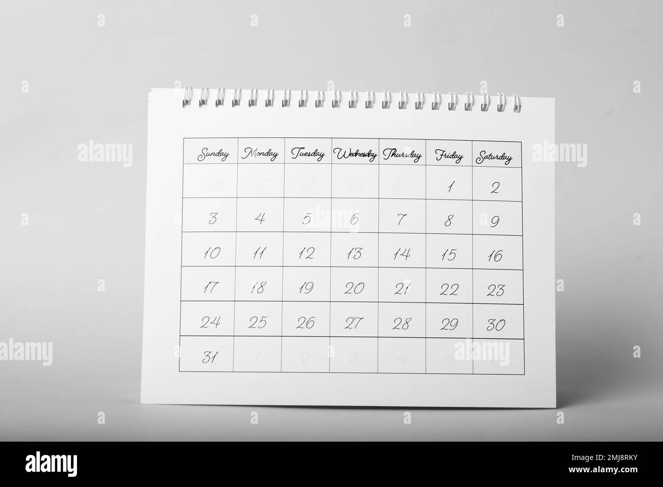 Paper calendar on grey background. Planning concept Stock Photo - Alamy