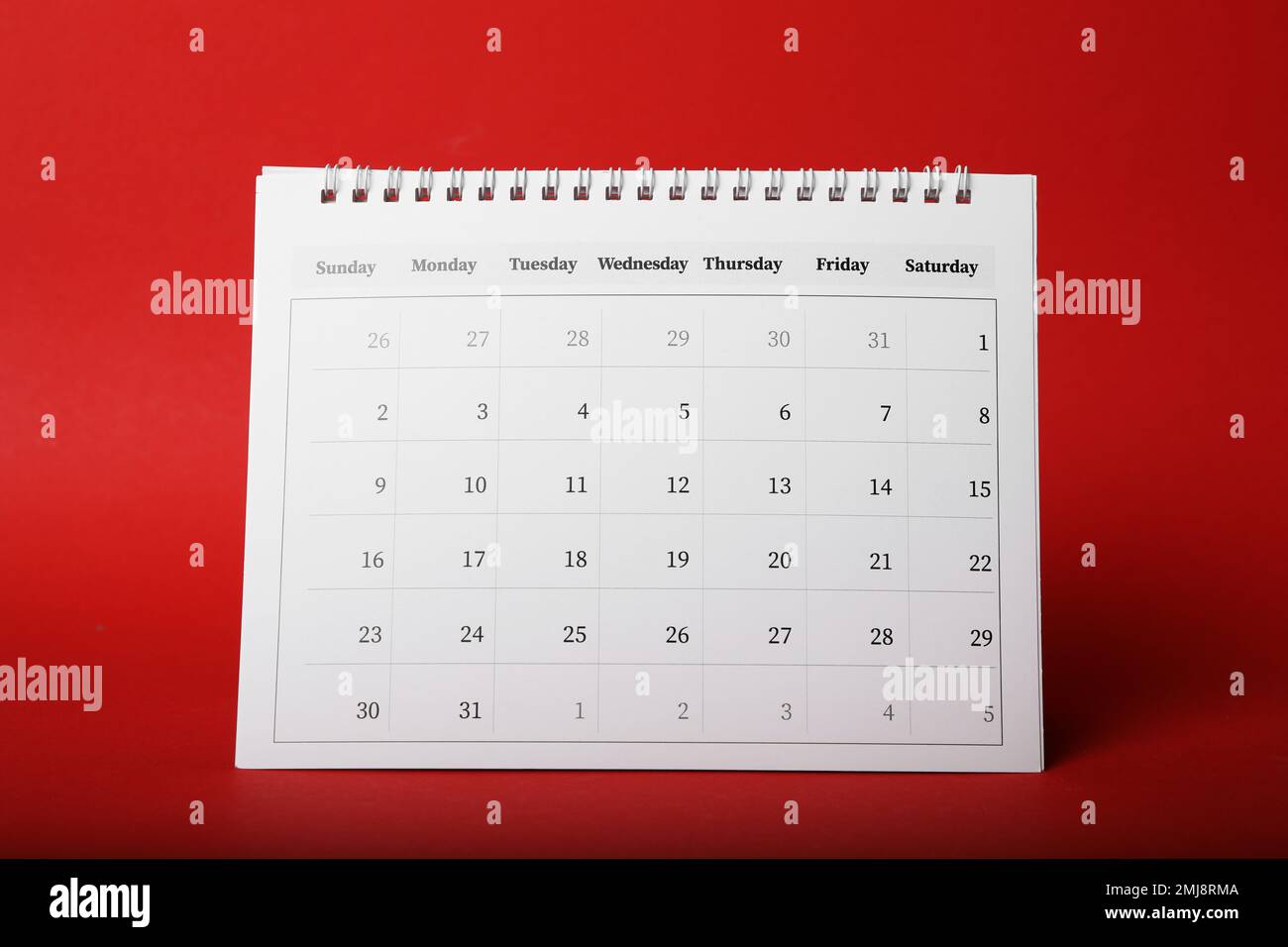 Paper calendar on red background. Planning concept Stock Photo - Alamy