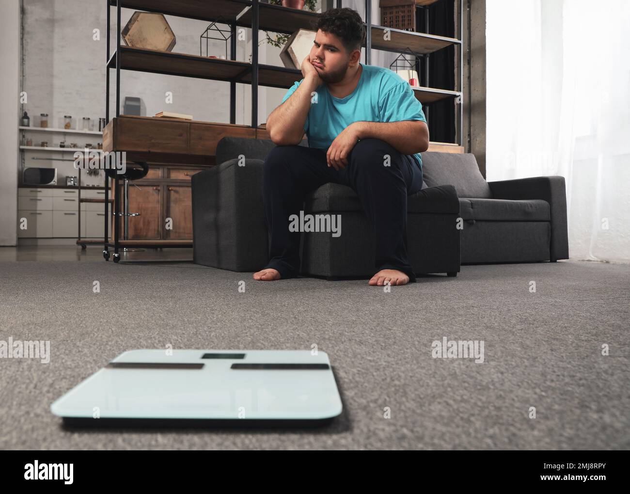 Fat man scales hi-res stock photography and images - Alamy