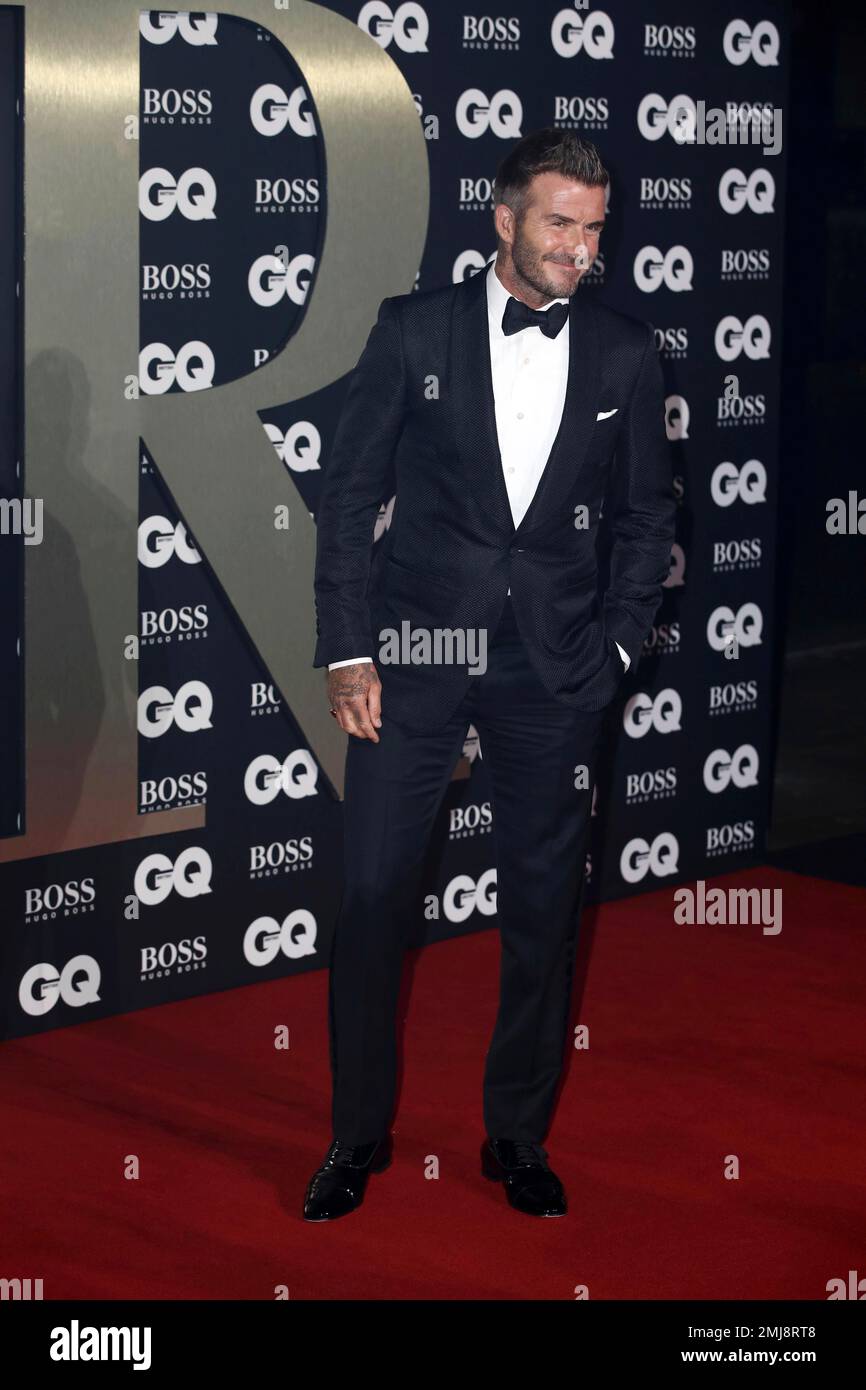 Footballer David Beckham poses for photographers on arrival at the GQ ...