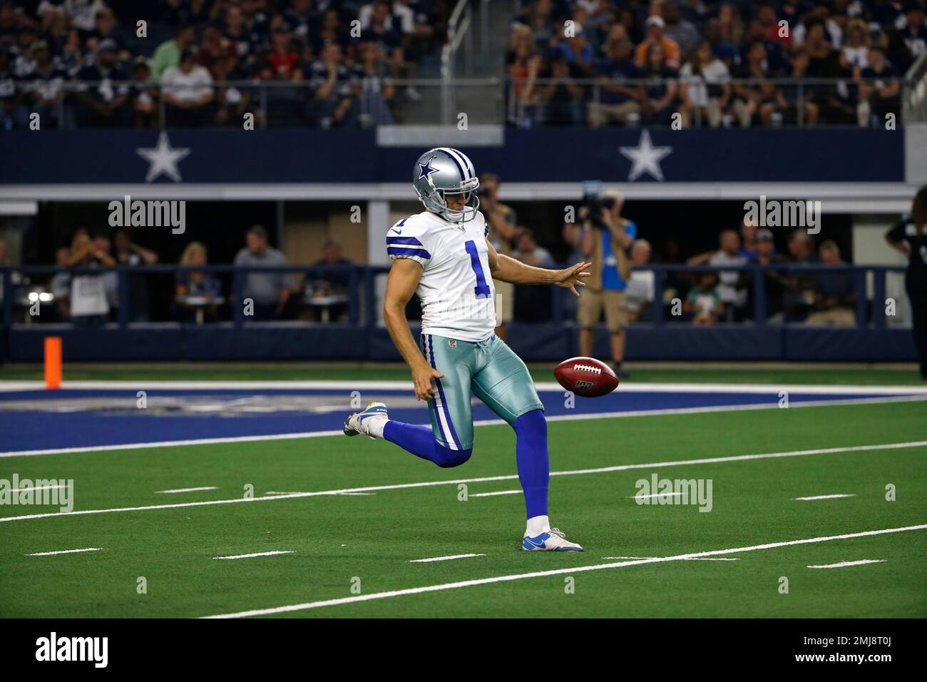 Dallas Cowboys' Kasey Redfern punts to the Tampa Bay Buccaneers during ...