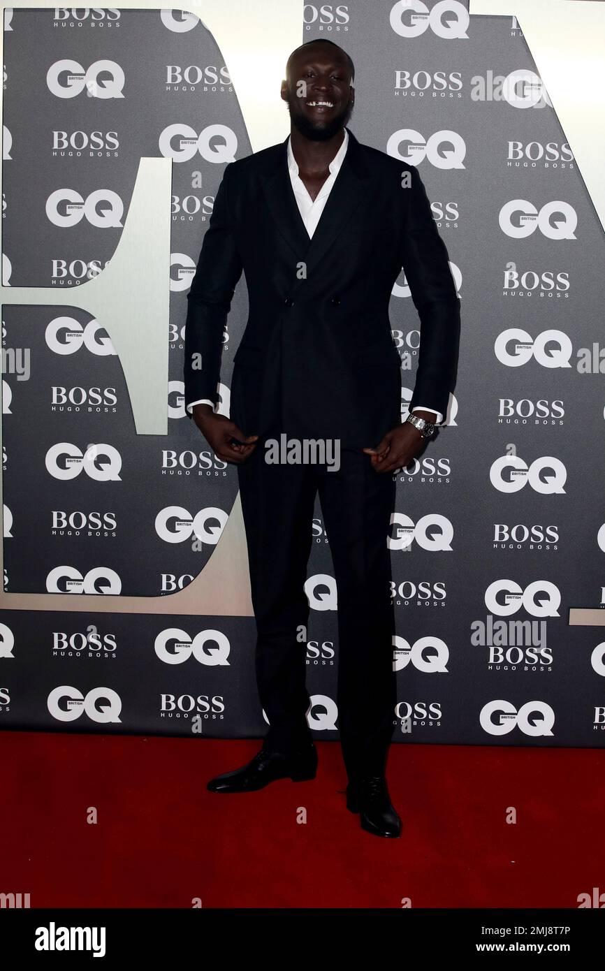 Musician Stormzy poses for photographers on arrival at the GQ Men of ...