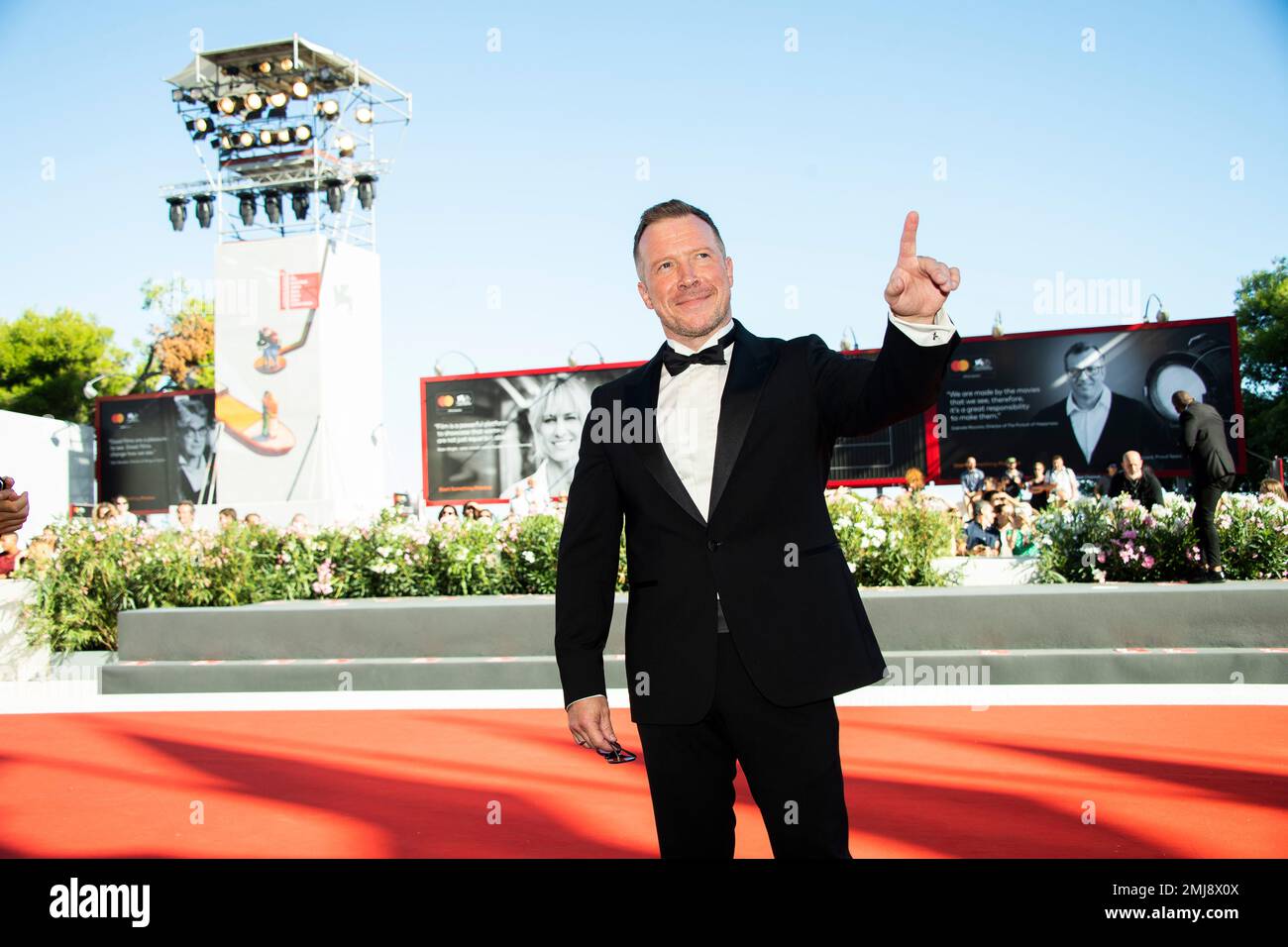 Actor Aleksei Kravchenko poses for photographers upon arrival at the ...