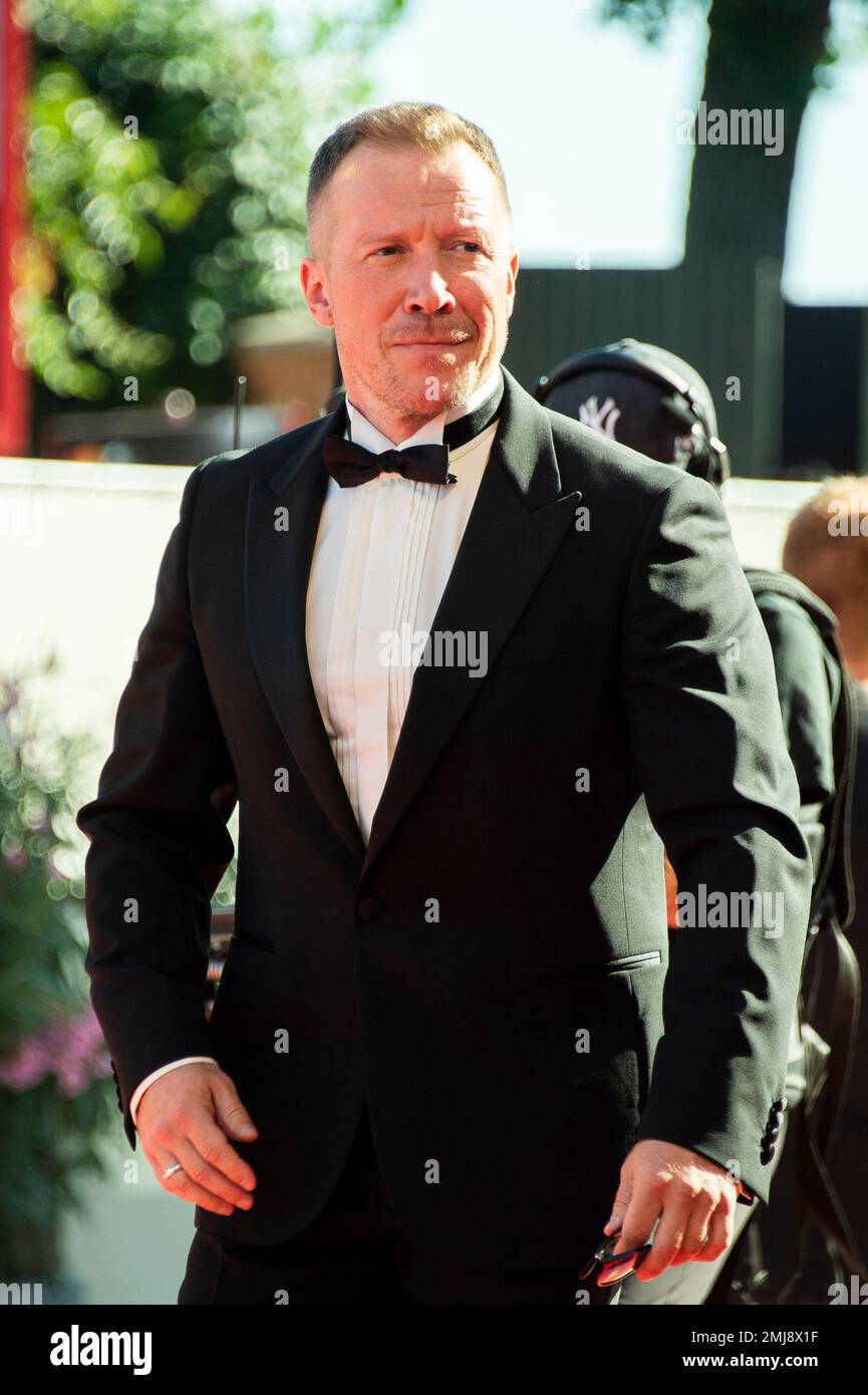 Aleksei Kravchenko poses for photographers upon arrival at the premiere ...