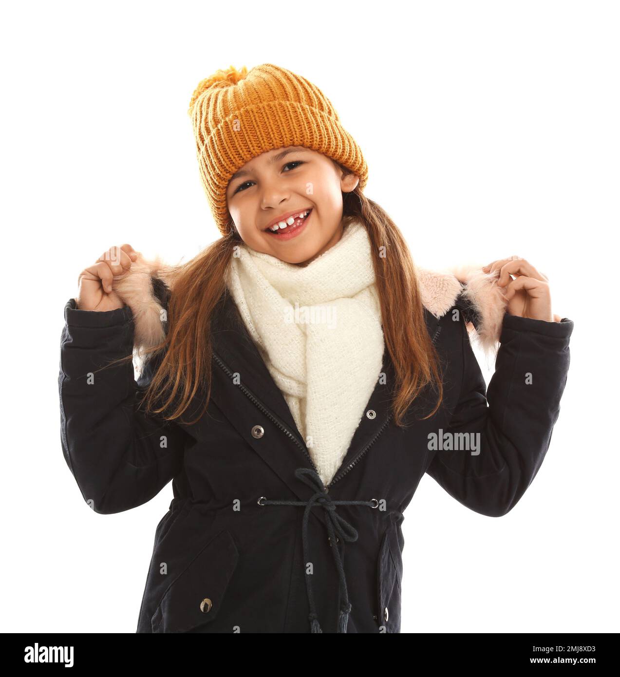 Cute little girl in warm clothes on white background. Winter vacation ...