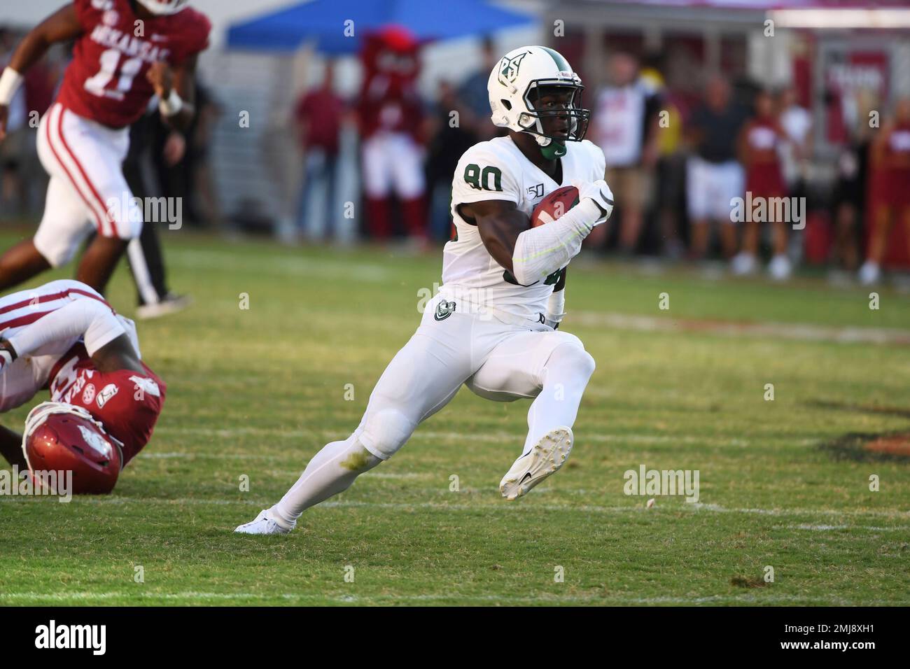 Portland State receiver Emmanuel Daigbe runs thew ball against Arkansas ...