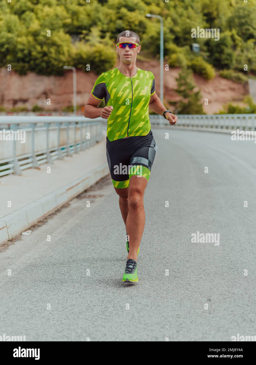 An athlete running a marathon and preparing for his competition. Photo ...