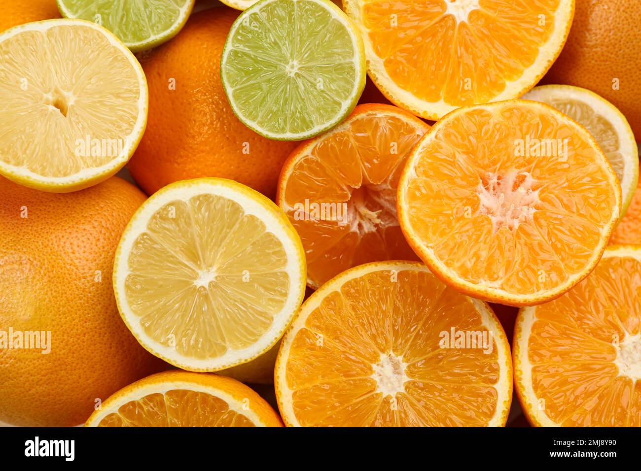 Tangerines and different citrus fruits as background, top view Stock ...